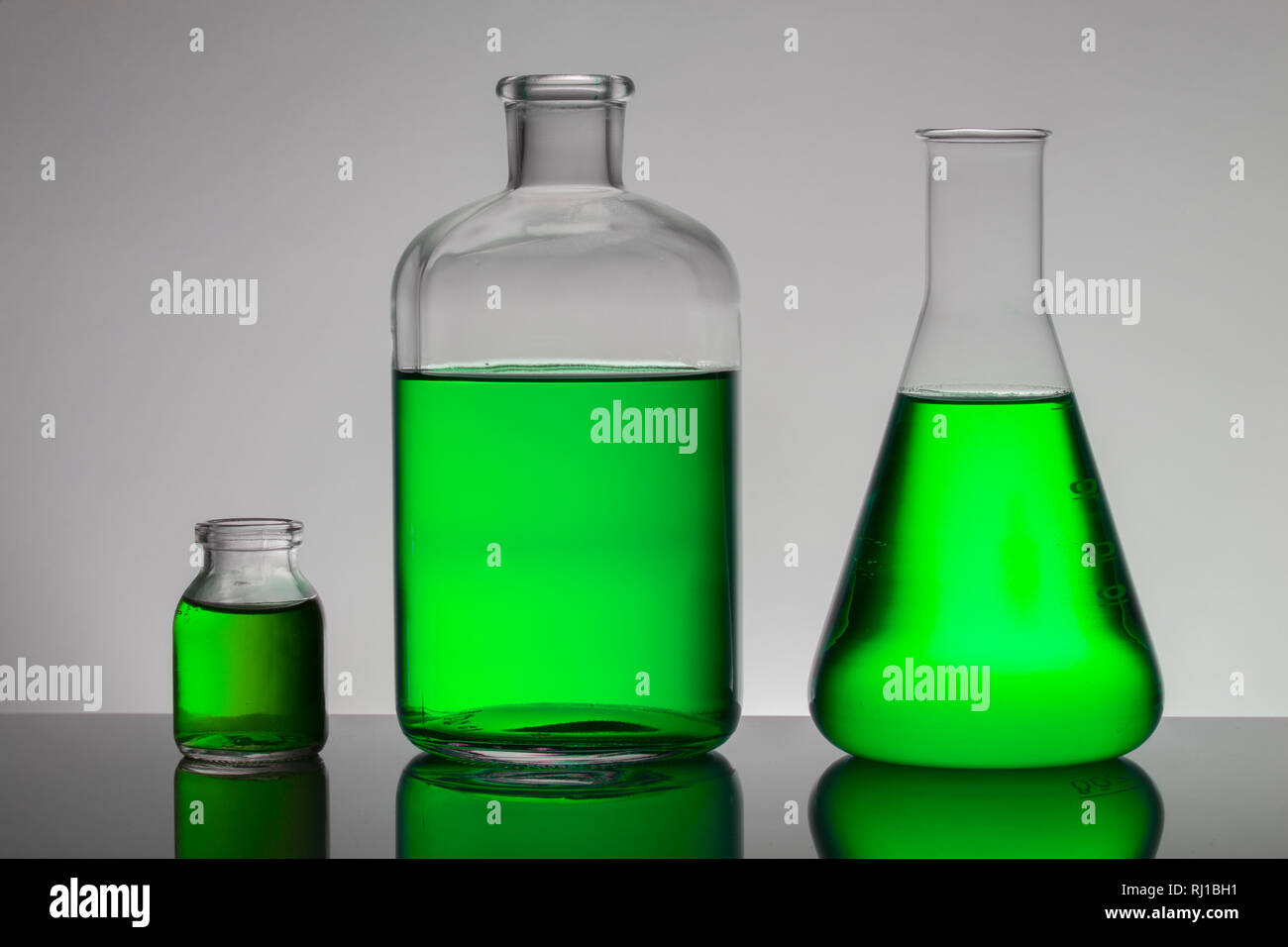 Liquid in laboratory bottles. Scientific biochemical laboratory ...