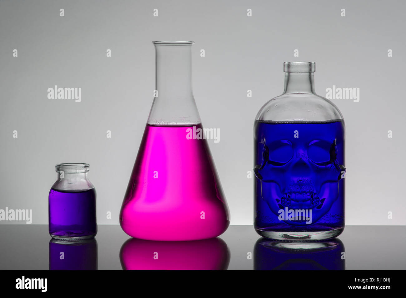 Liquid in laboratory bottles. Scientific biochemical laboratory ...