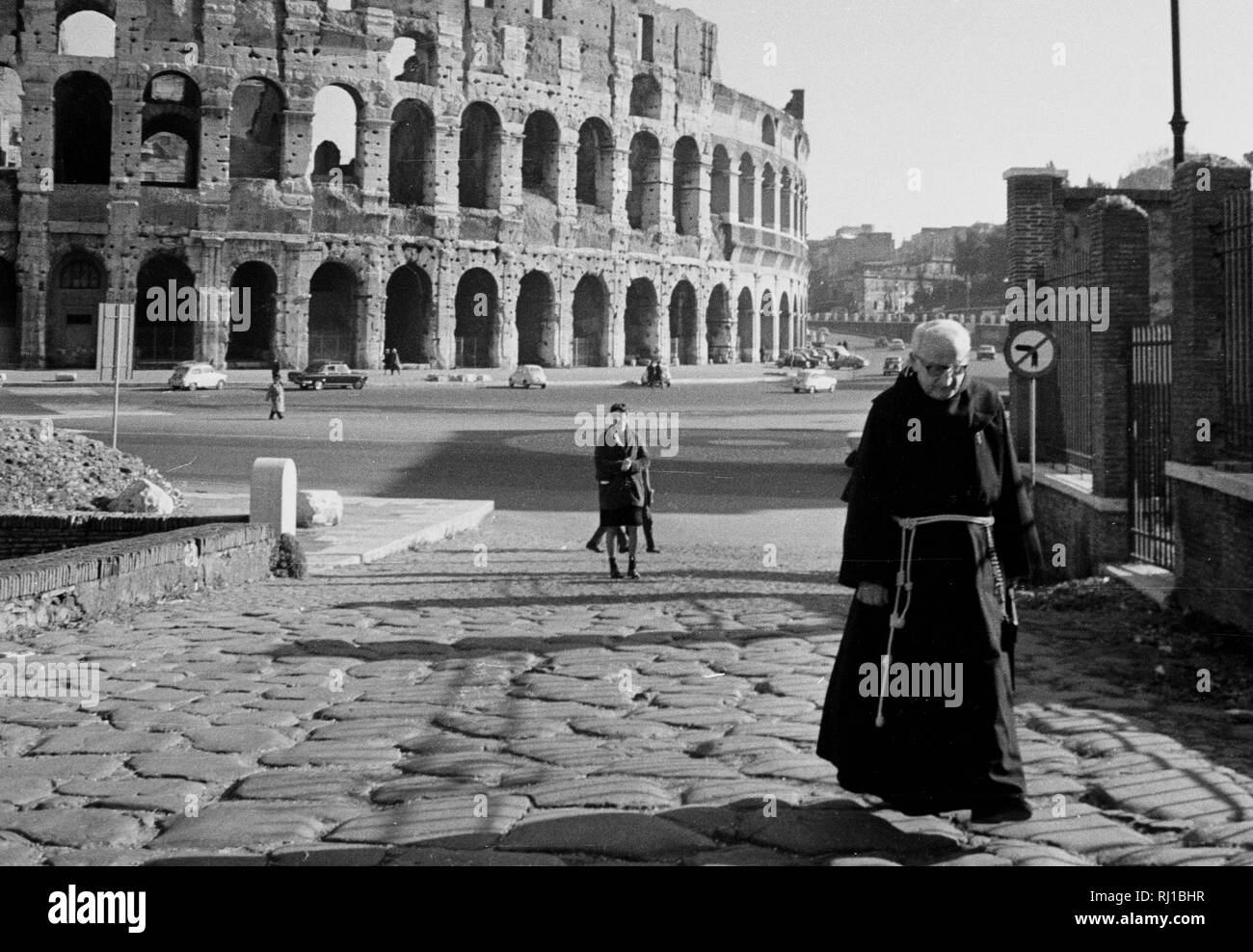 A monk walking on the ancient pavement in Rome. Photo taken in 1967 ...