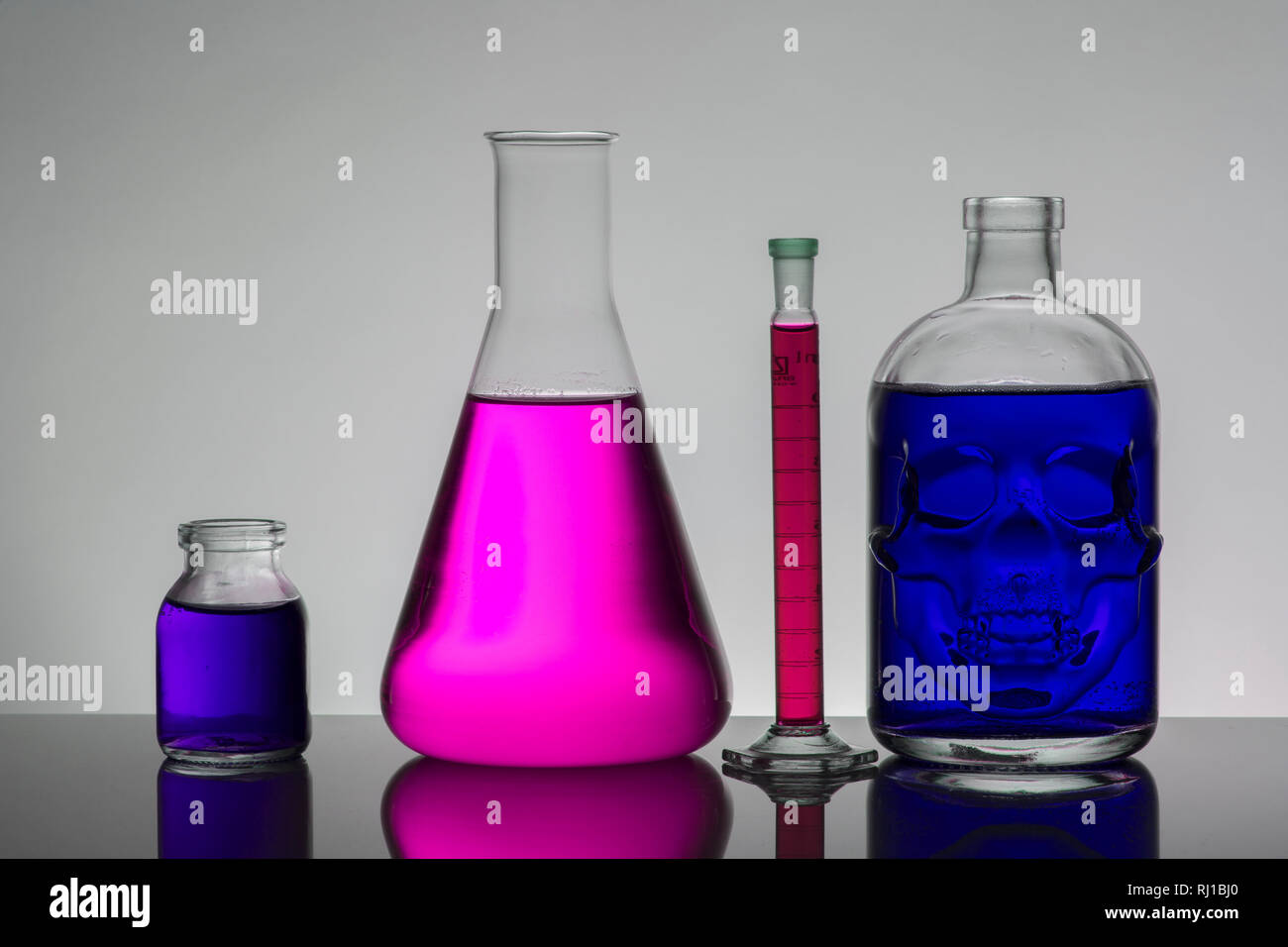 Liquid in laboratory bottles. Scientific biochemical laboratory ...