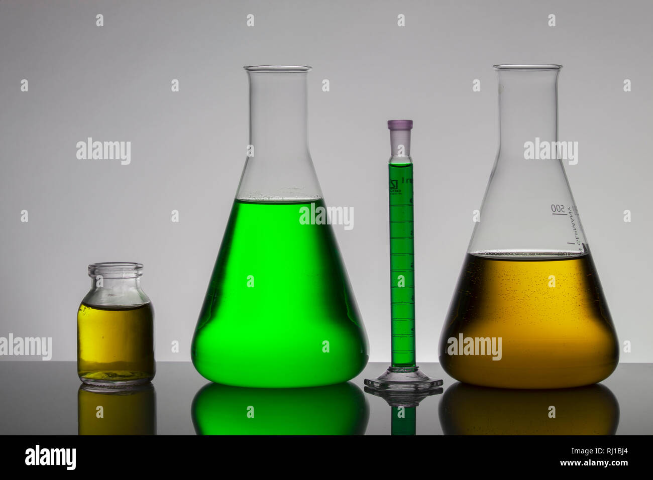 Liquid in laboratory bottles. Scientific biochemical laboratory ...