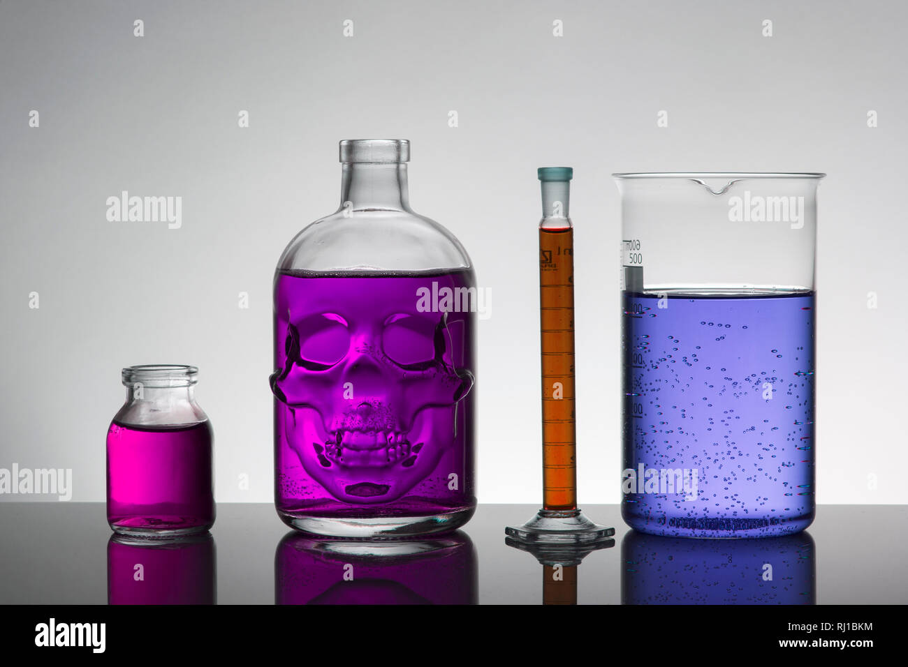 Liquid in laboratory bottles. Scientific biochemical laboratory ...