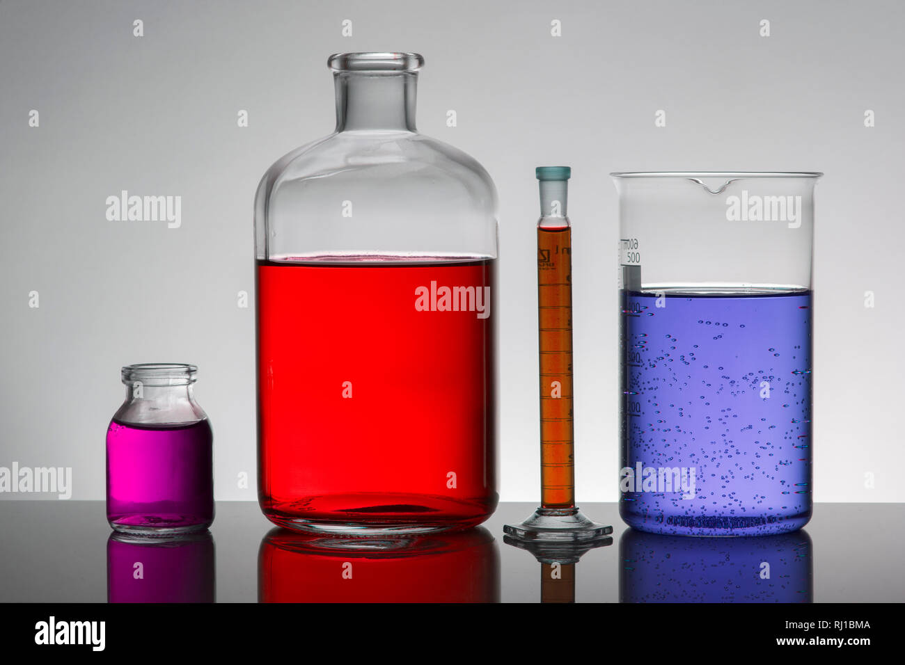 Liquid in laboratory bottles. Scientific biochemical laboratory ...