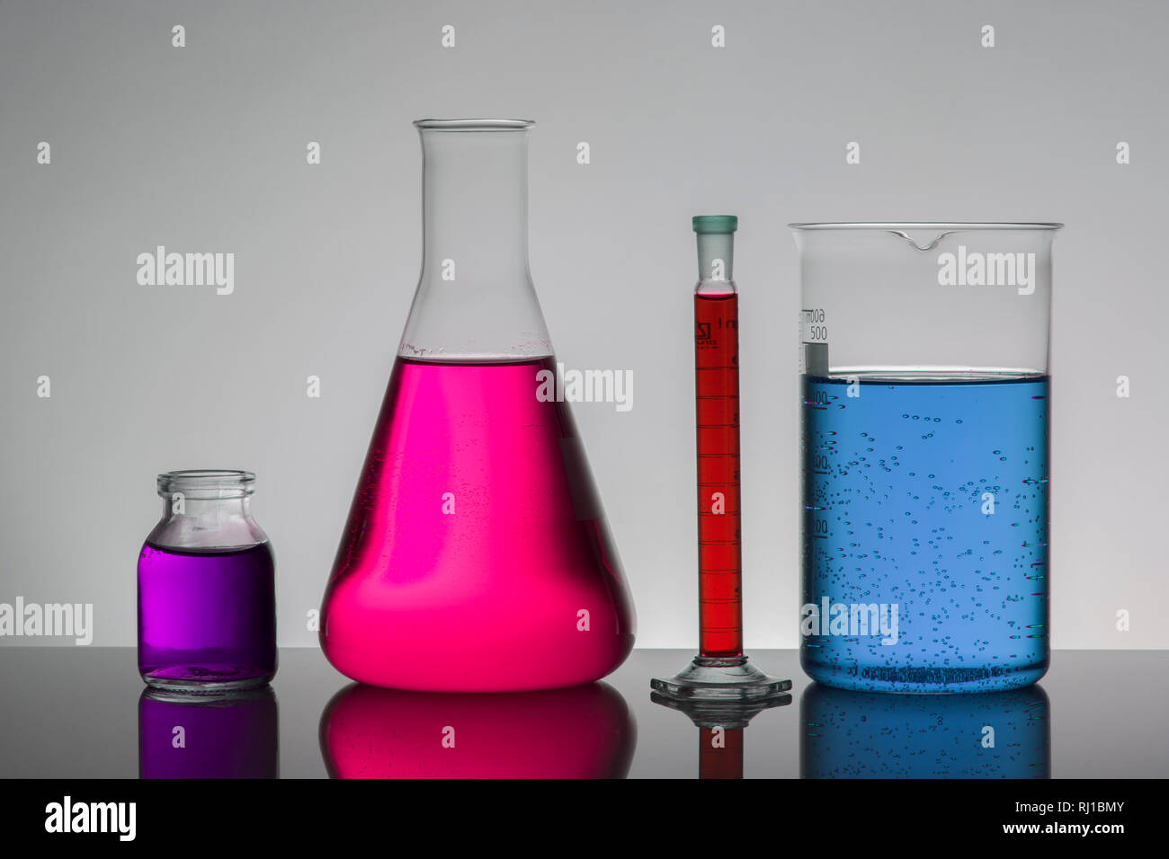 Liquid in laboratory bottles. Scientific biochemical laboratory ...