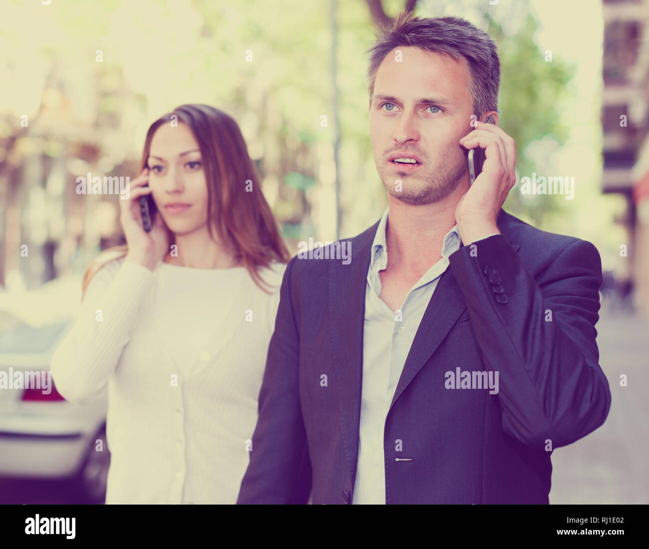 Couple on phones ignoring each other hi-res stock photography and ...