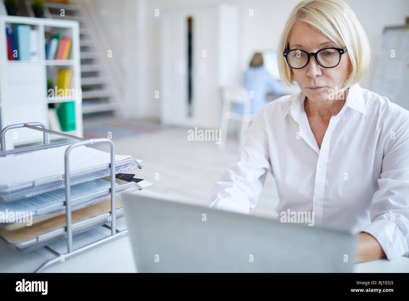 Mature Female Manager Stock Photo - Alamy