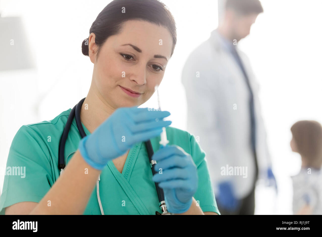 Smiling boy doctor syringe hi-res stock photography and images - Alamy