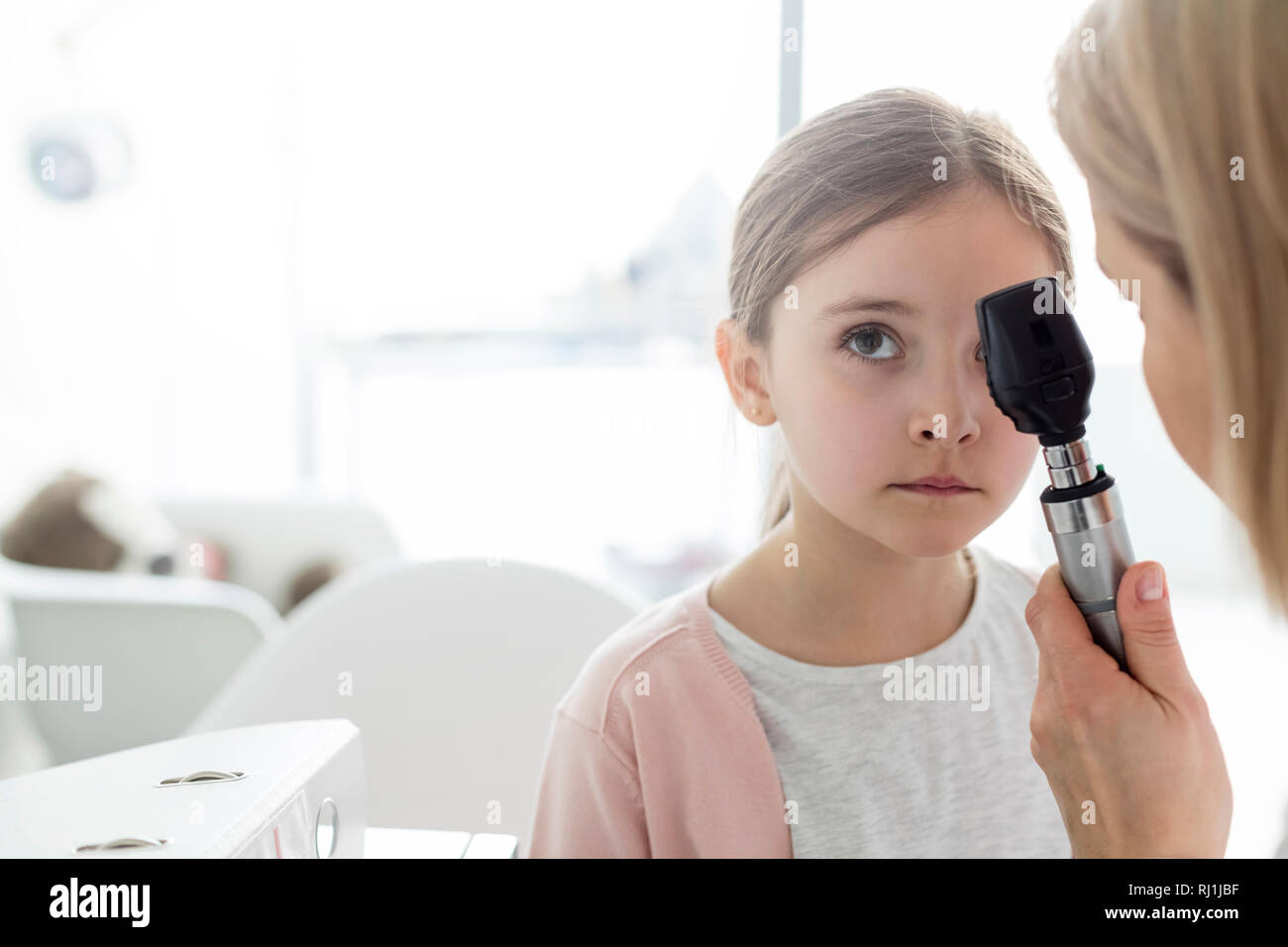 Doctor testing girl patient at hospital Stock Photo - Alamy