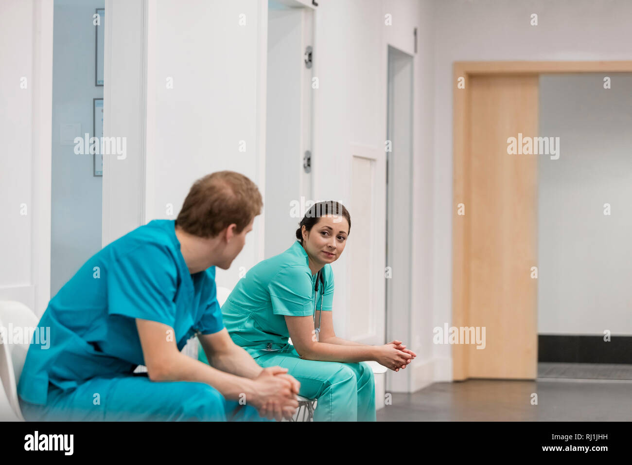 Two people in hospital sitting hi-res stock photography and images - Alamy