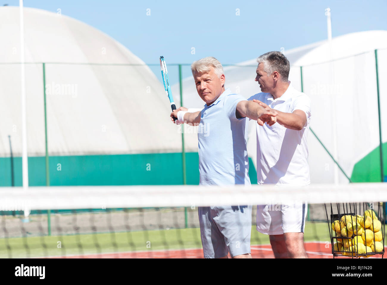 Tennis player swinging racket hi-res stock photography and images - Alamy