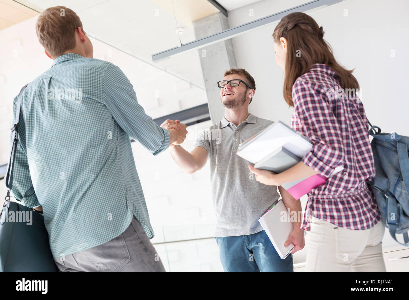 Smiling greeting holding standing communication hi-res stock ...