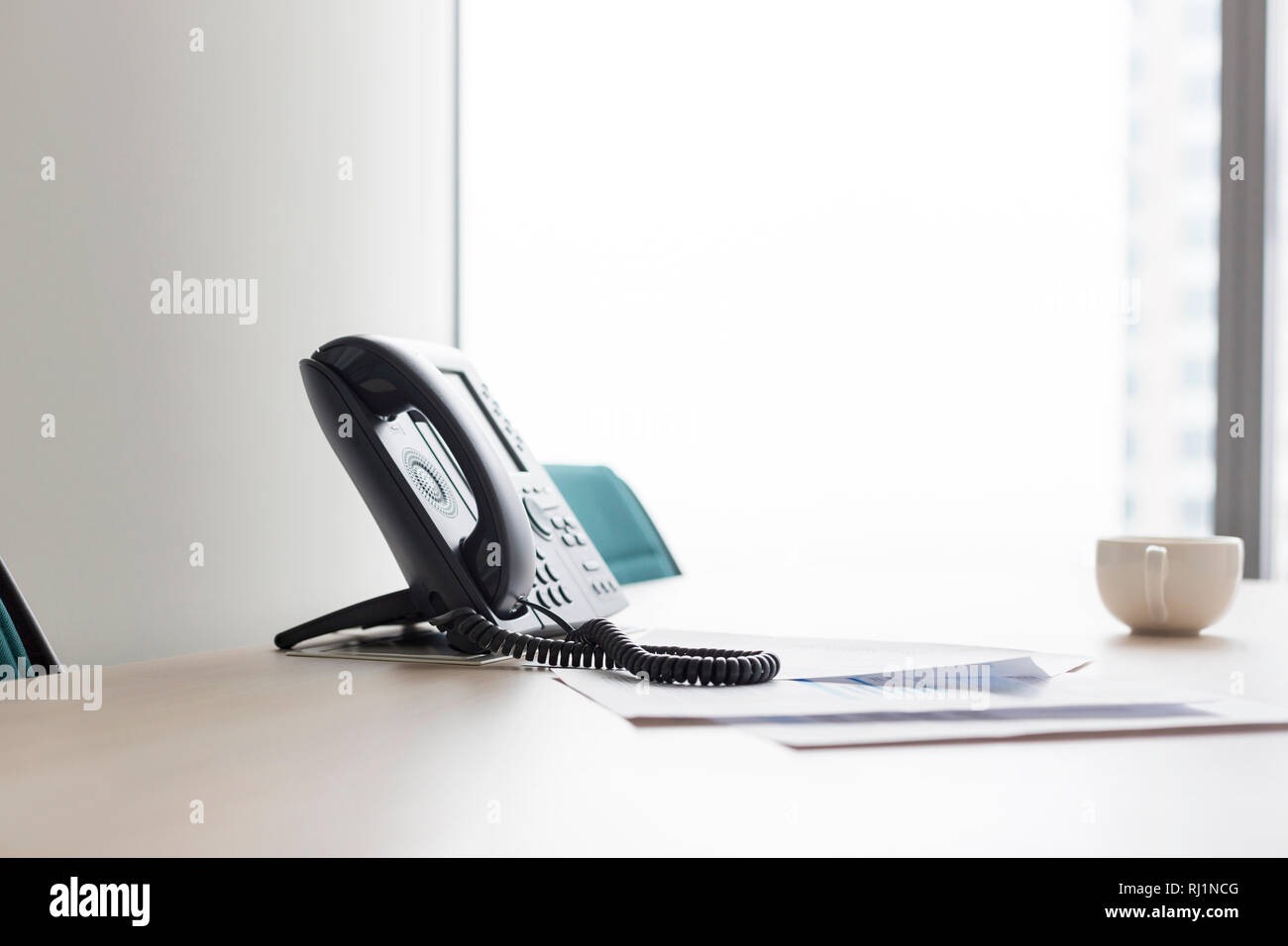Closeup of landline phone on desk in modern office Stock Photo - Alamy