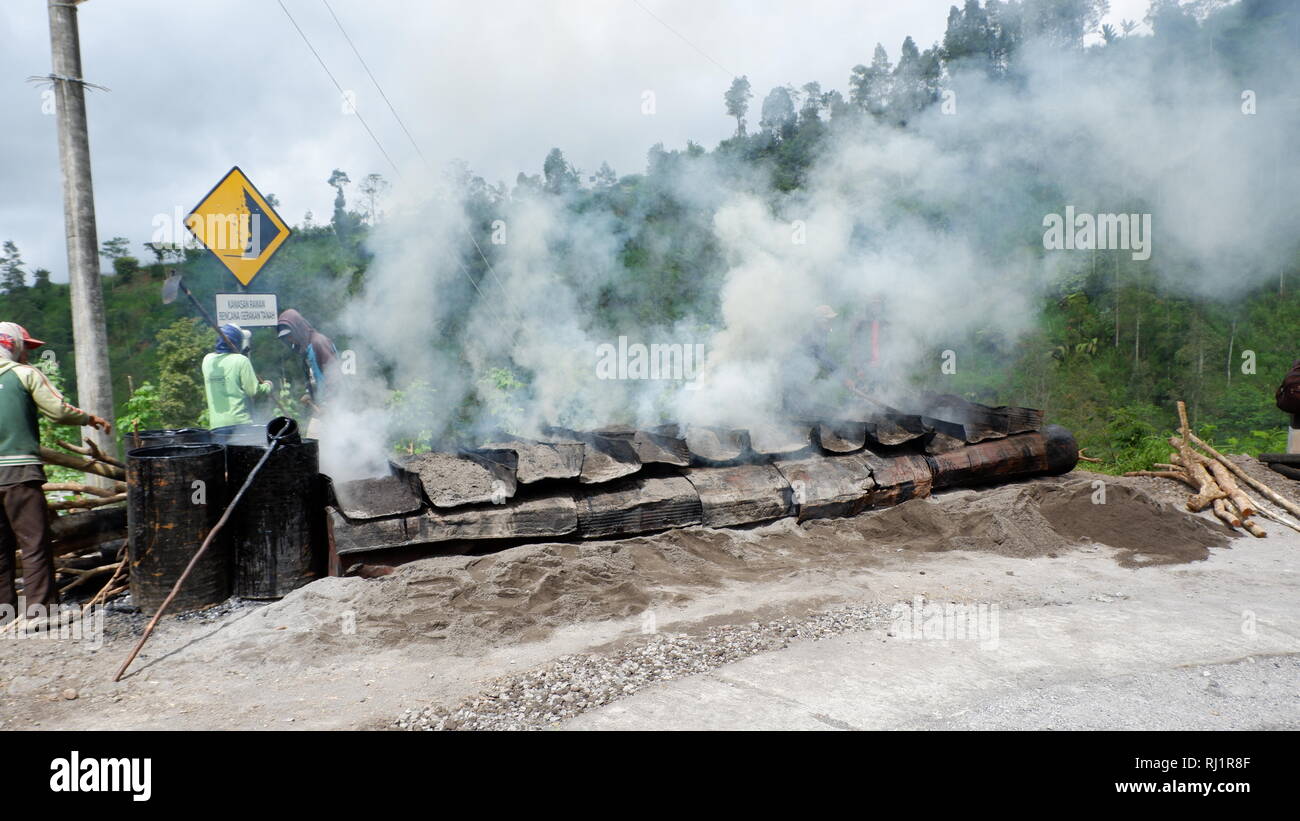 burning asphalt for raw materials for making roads Stock Photo - Alamy