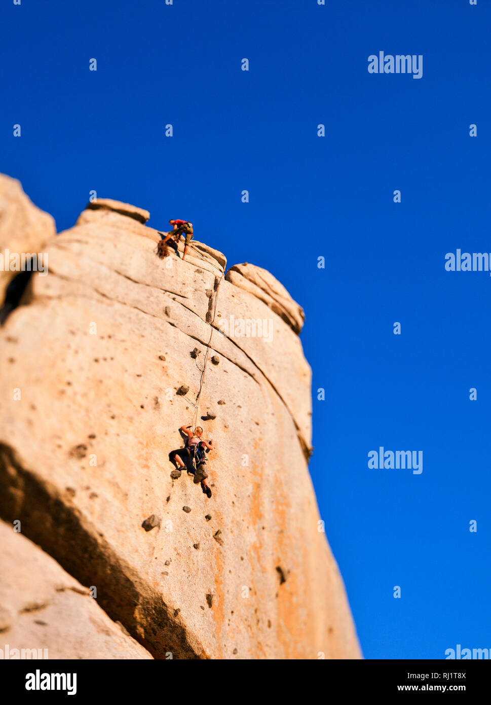 Two men climbing on rocks hi-res stock photography and images - Alamy