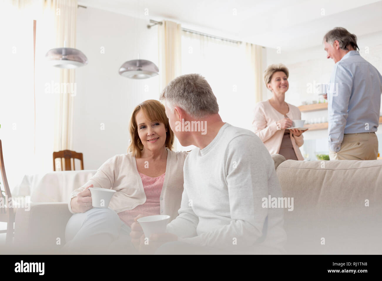 Mature couples smiling hi-res stock photography and images - Alamy