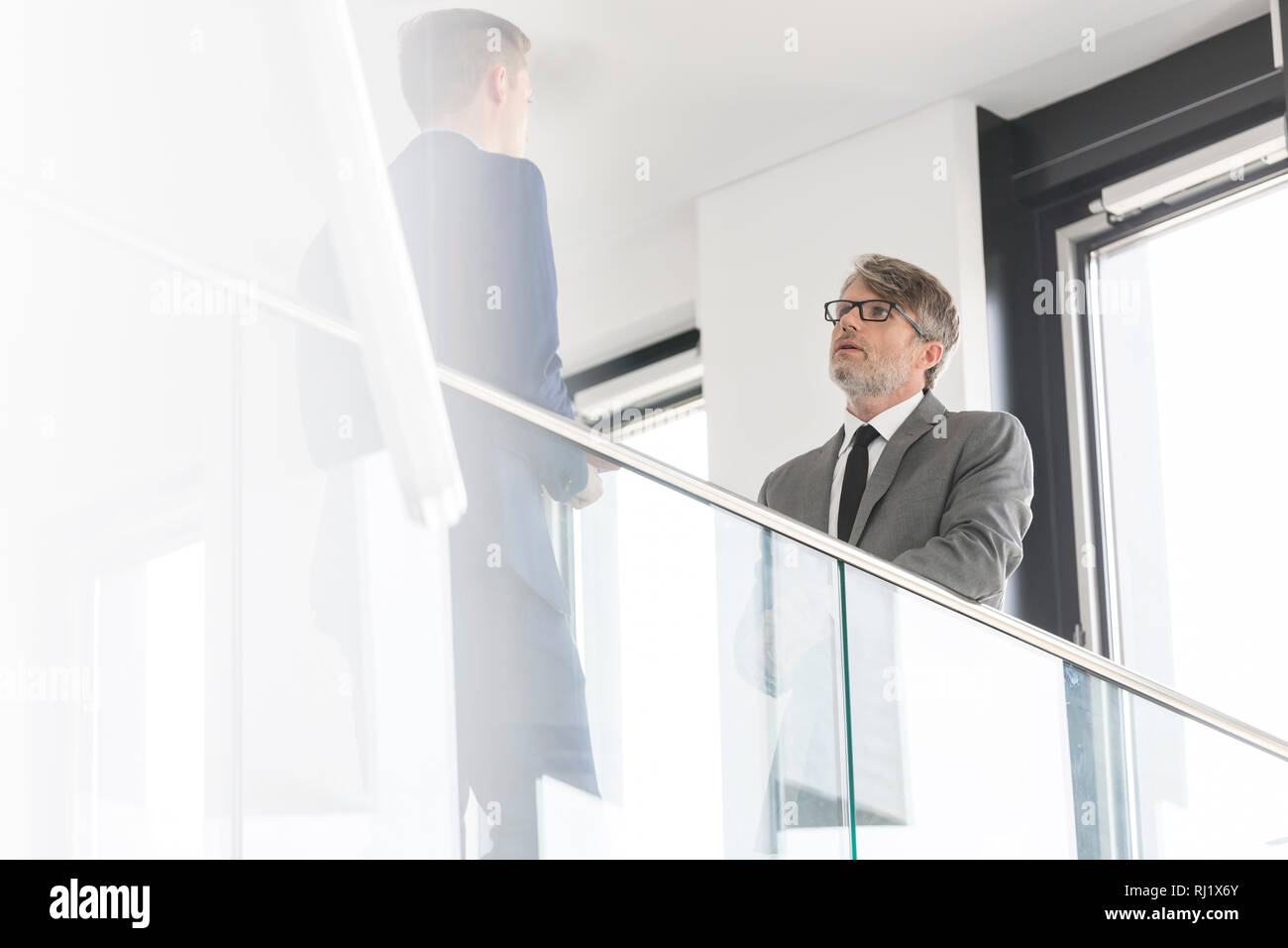 Businessman office railing hi-res stock photography and images - Alamy
