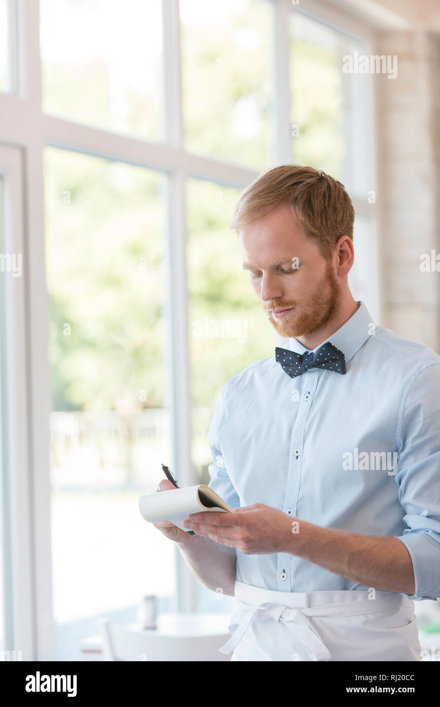Writing waiter hi-res stock photography and images - Alamy