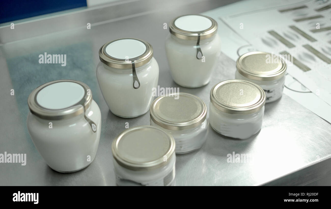 Jars with natural sour cream at dairy factory Stock Photo - Alamy
