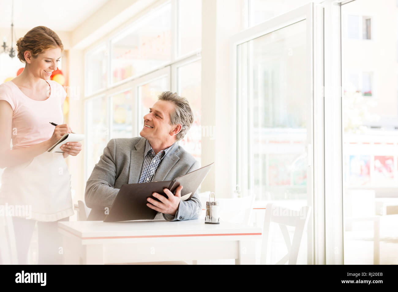 Man giving an order hi-res stock photography and images - Alamy