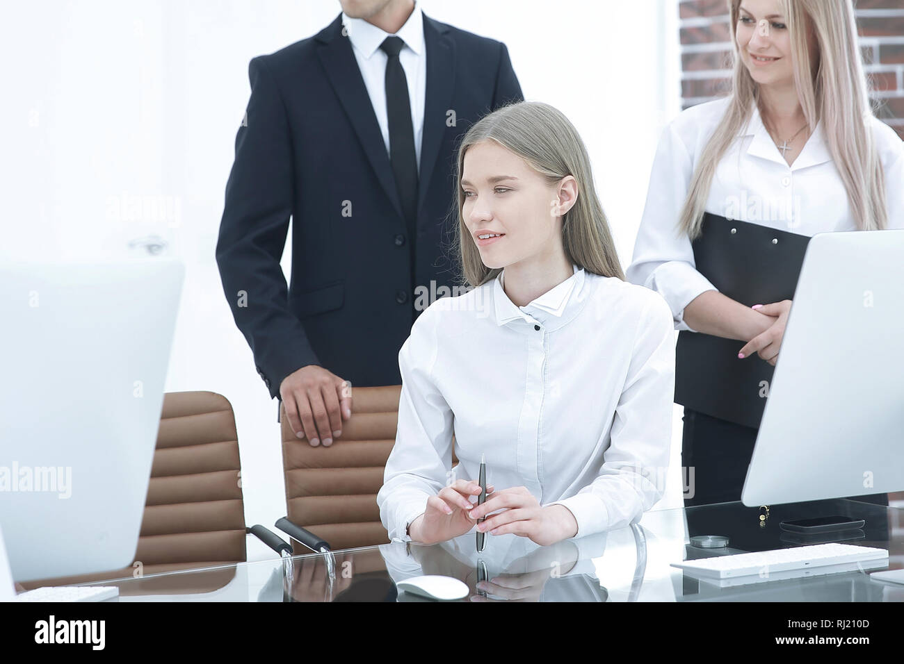 closeup.the employees are talking in a modern office Stock Photo - Alamy
