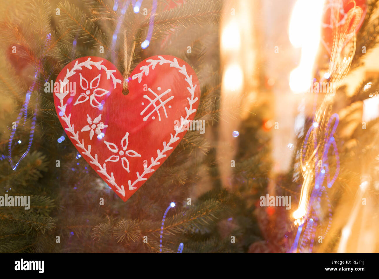 Red heart on spruce and pine background. Valentine's Day. Symbol of ...