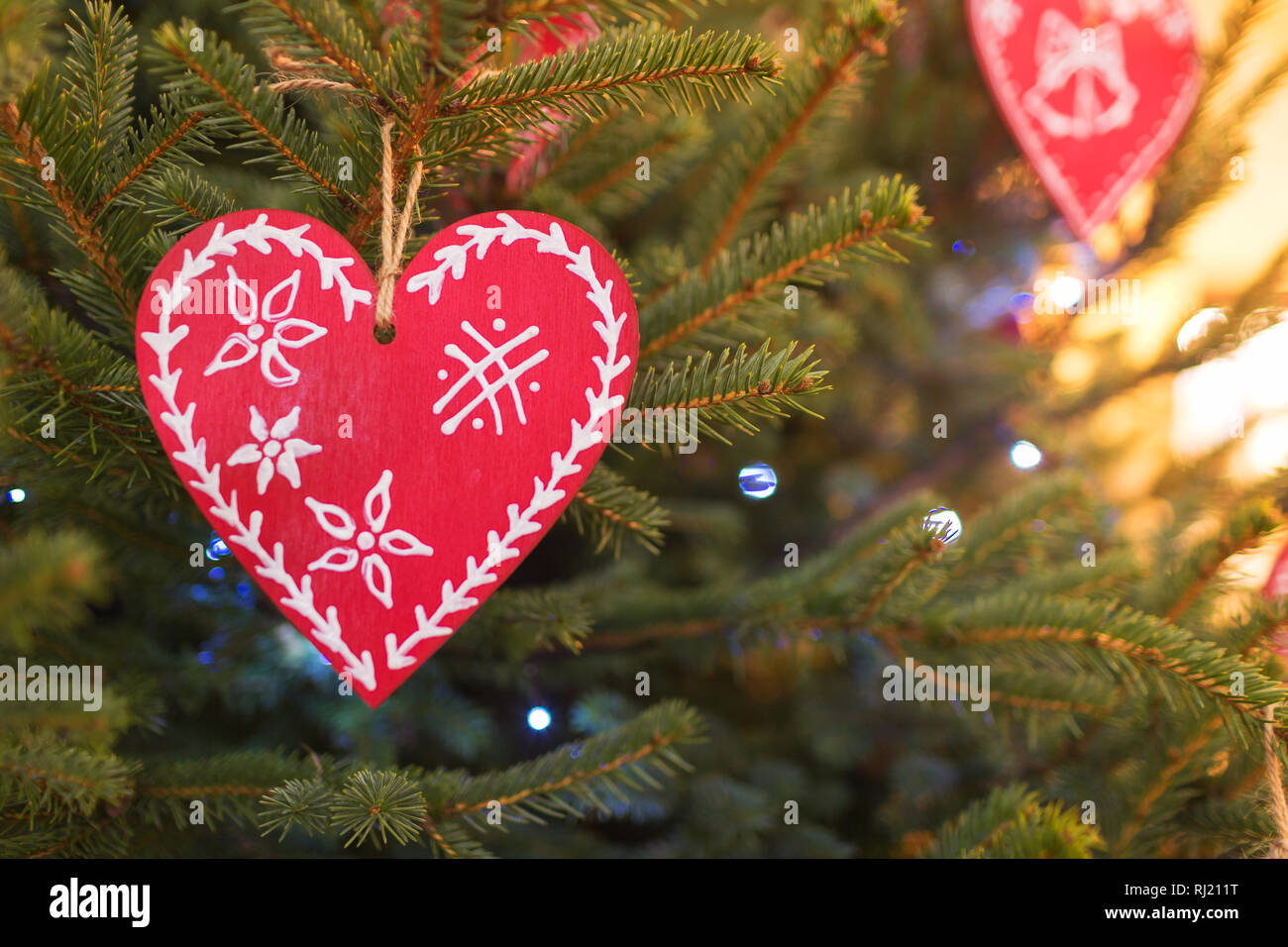 Red heart on spruce and pine background. Valentine's Day. Symbol of ...