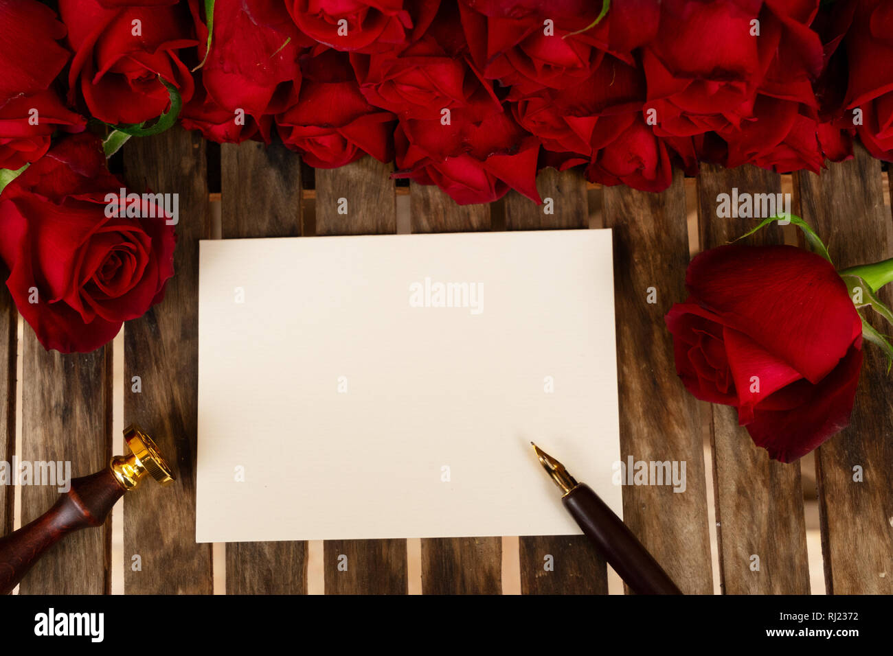 dark red roses on table Stock Photo - Alamy