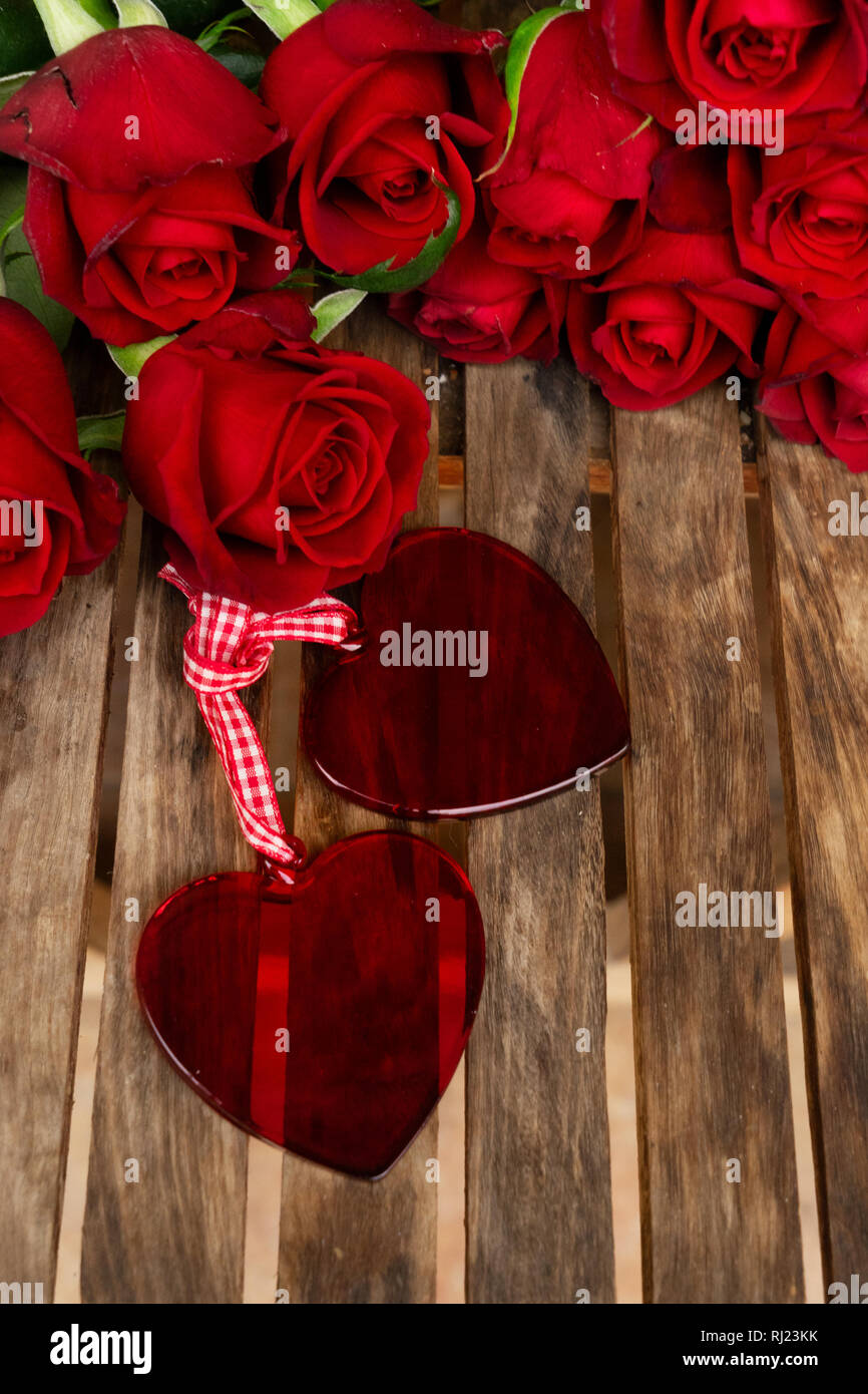dark red roses on table Stock Photo - Alamy