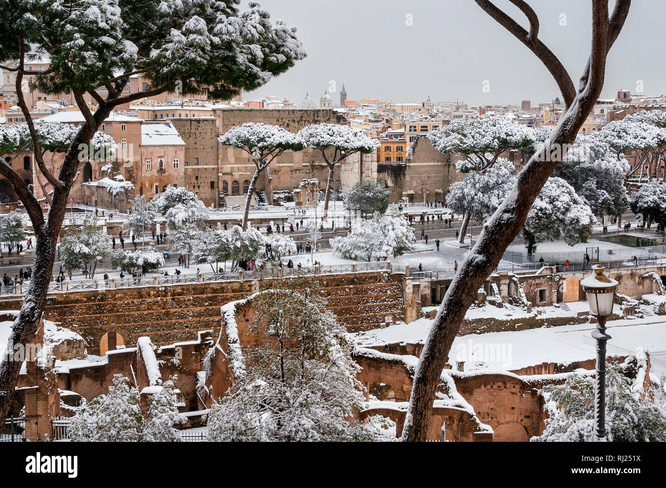 Winter in Rome. Snow falling on Imperial Fora ancient ruins Stock Photo ...