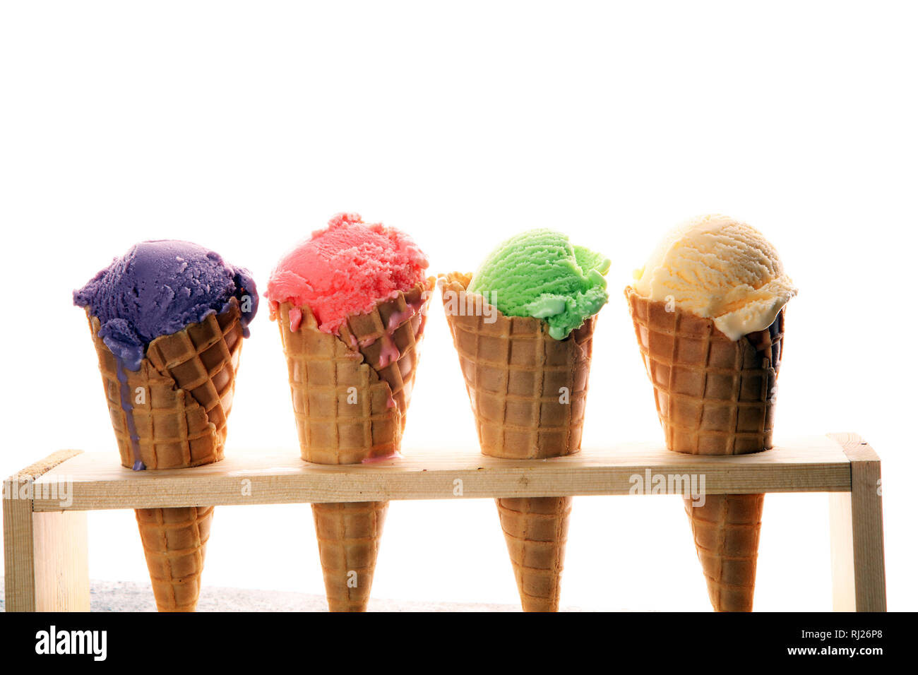 Set of ice cream scoops of different colors and flavours with berries ...