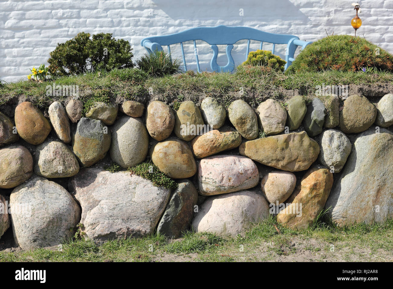 Frisian stone wall and Frisian bench Stock Photo - Alamy