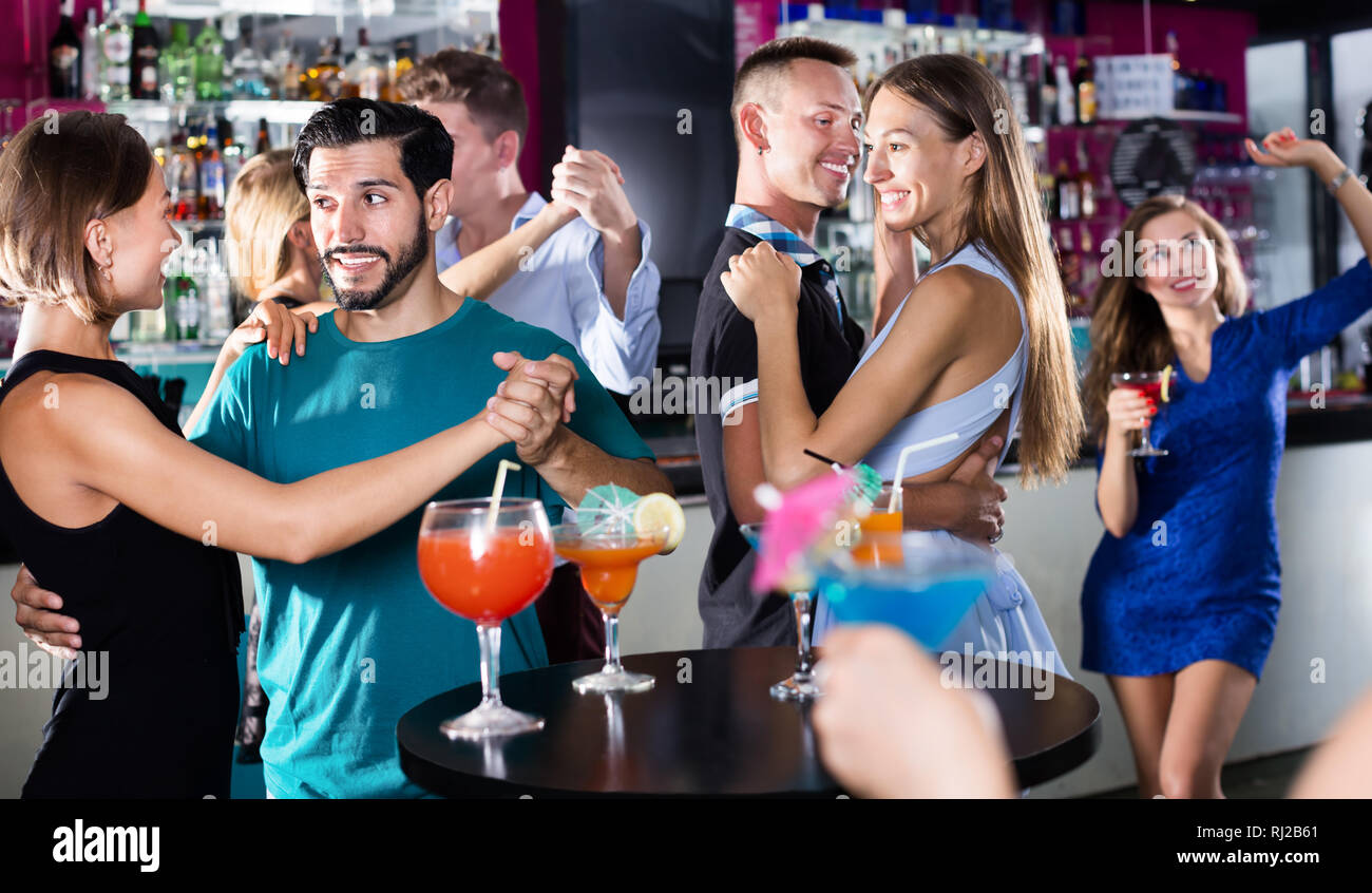 Female with man are dancing in pair on the party at the bar Stock Photo ...