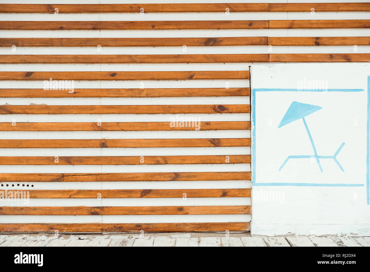 Blank rustic teal and orange wooden beach area sign on old wood ...