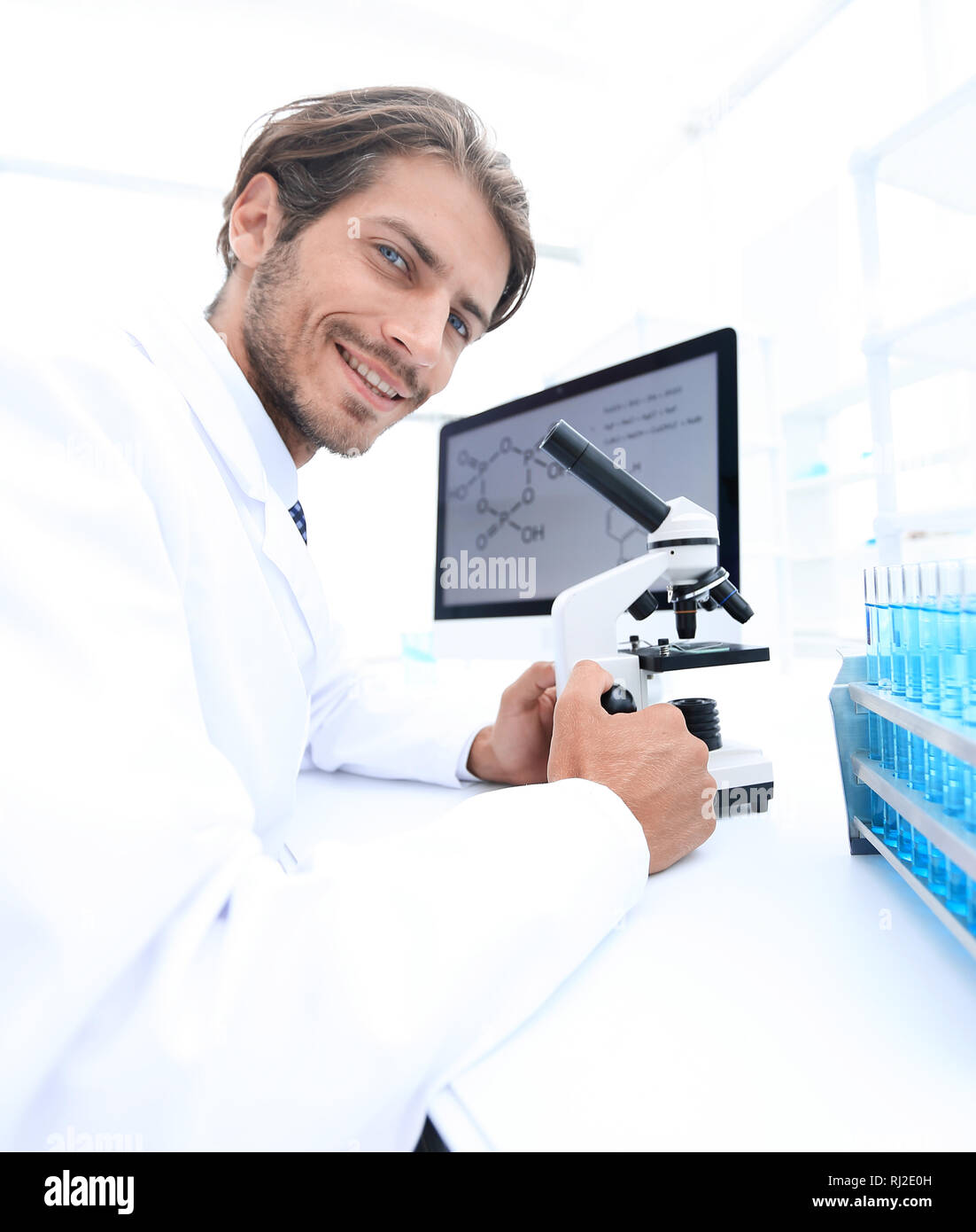 Student in biology using microscope in training class Stock Photo - Alamy