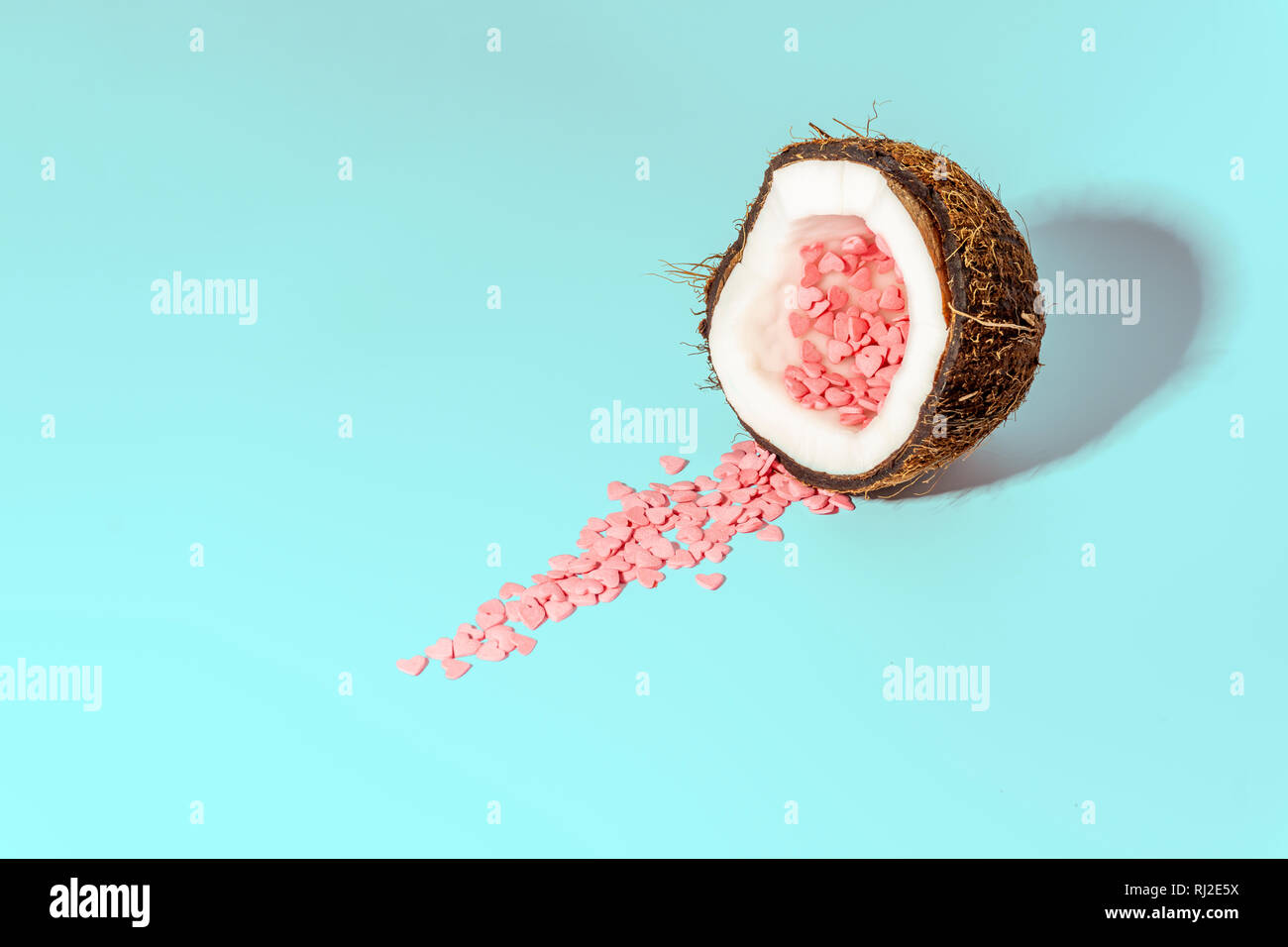 Love concept minimal. Bright colorful background with coconut and candy ...