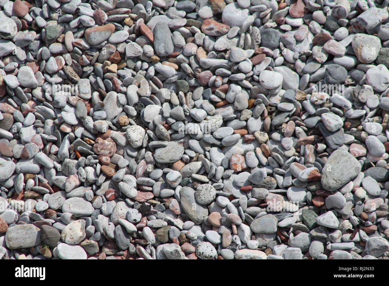 Pebbles on a beach Stock Photo - Alamy