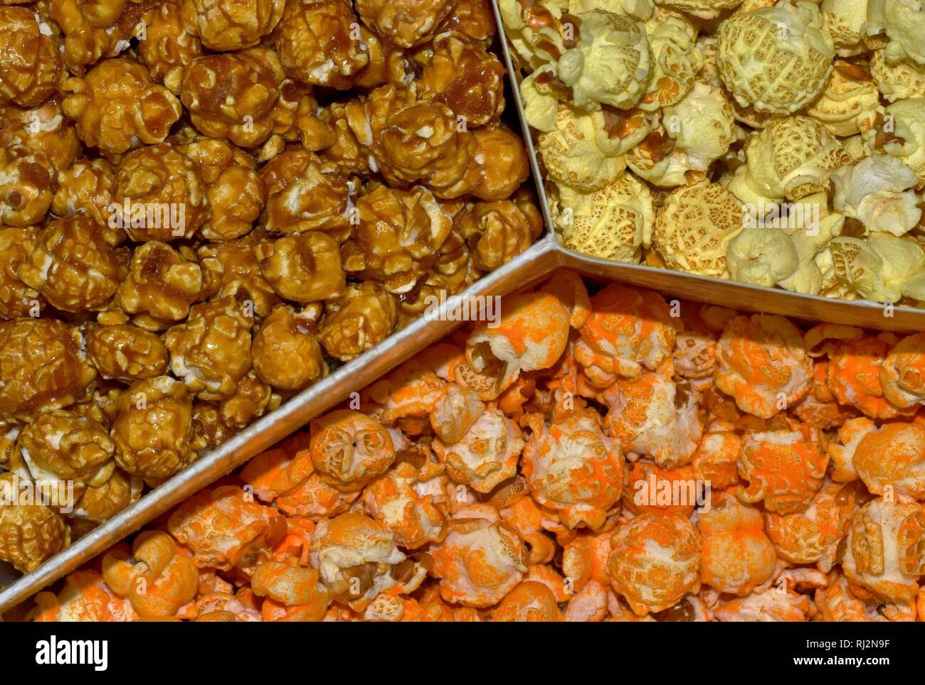 Top view of a variety mix of flavored popcorn, separated by dividers ...