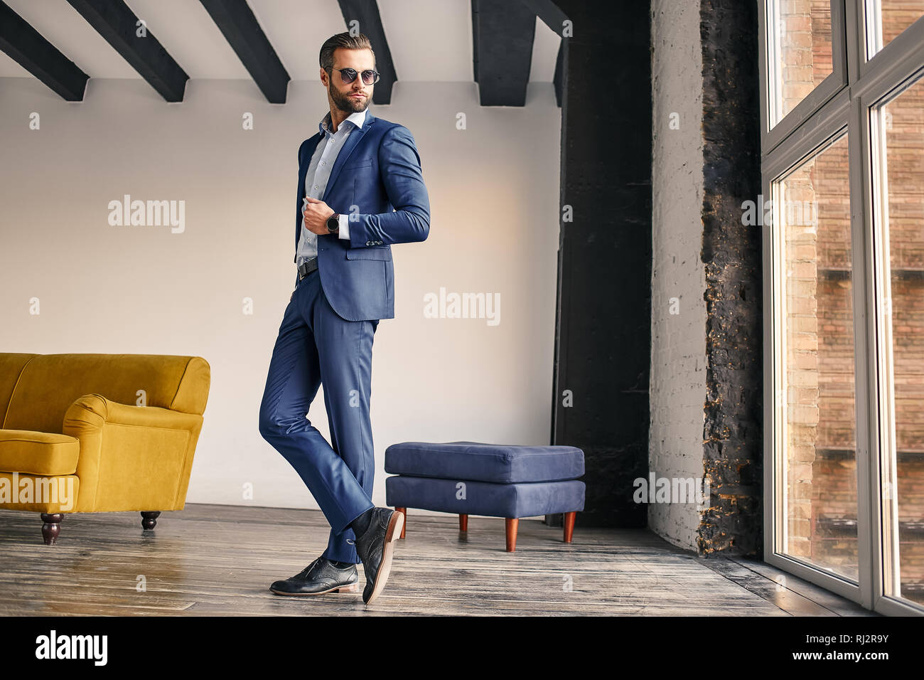 Success concept. Full height portrait of handsome and successful ...