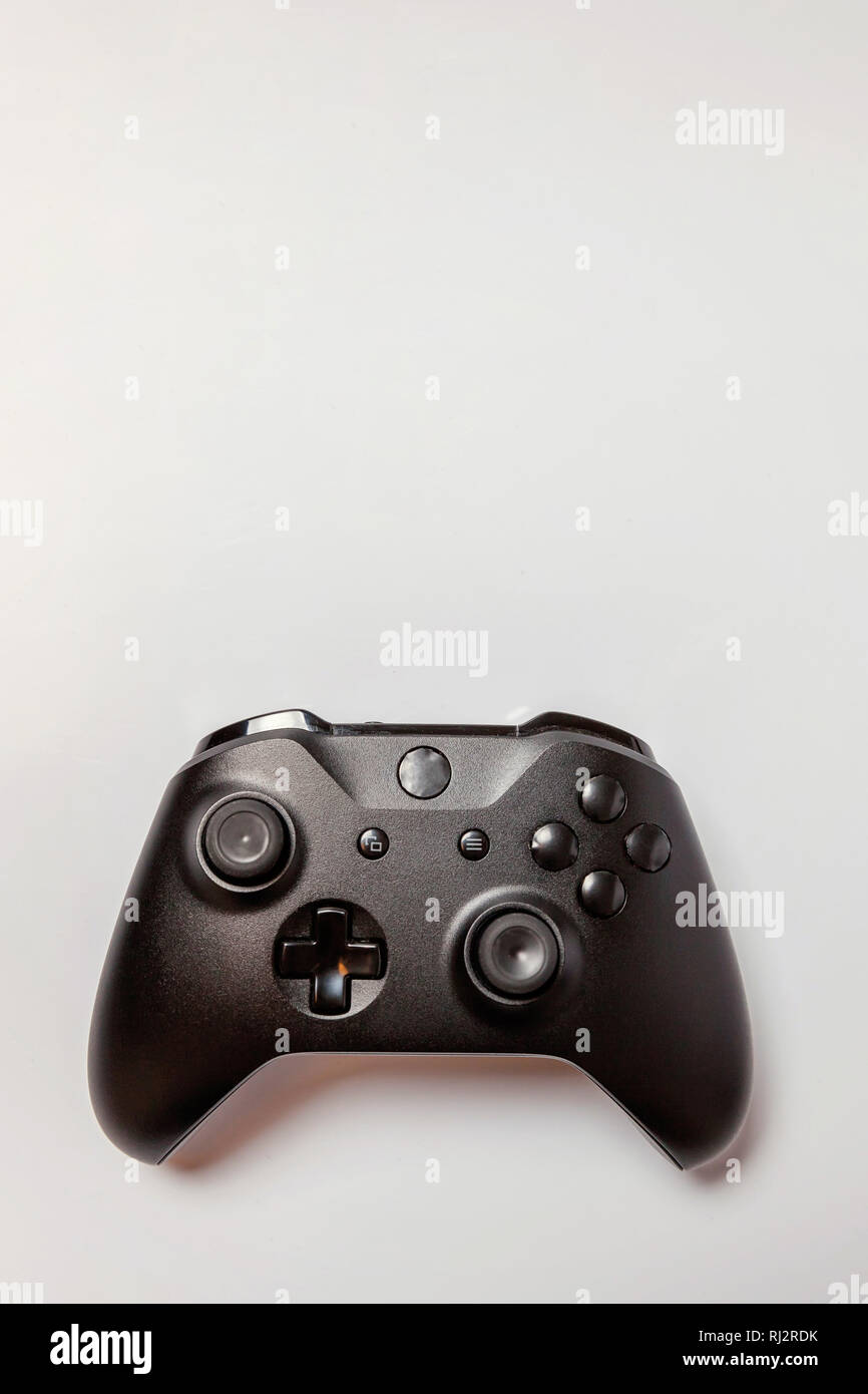 Black joystick gamepad, game console isolated on white background. Computer gaming technology ...