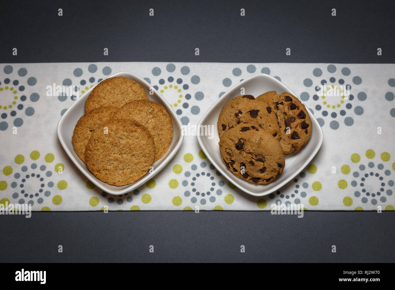 Two different kind of cookies, oatmeal and chocolate chip cookies in ...