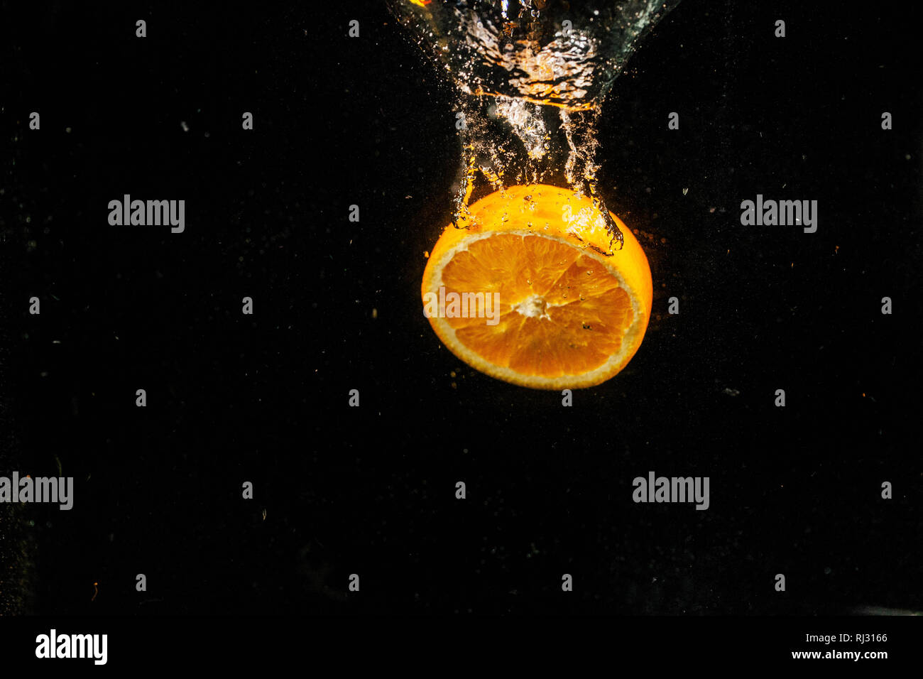 Orange falling into hi-res stock photography and images - Alamy
