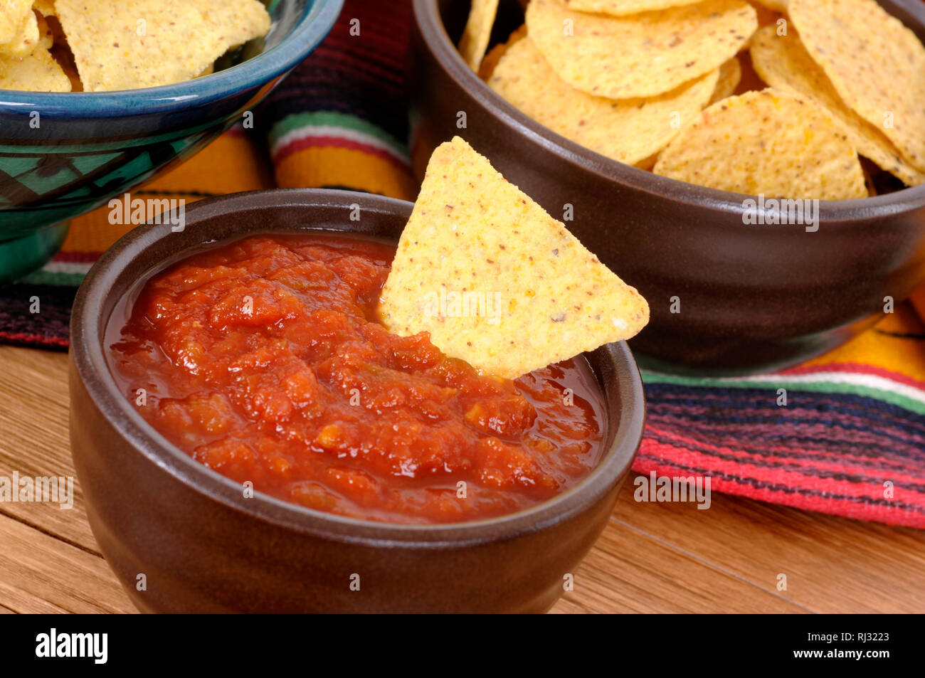 Mexican traditional serape blankets with salsa dip and tortilla chips ...