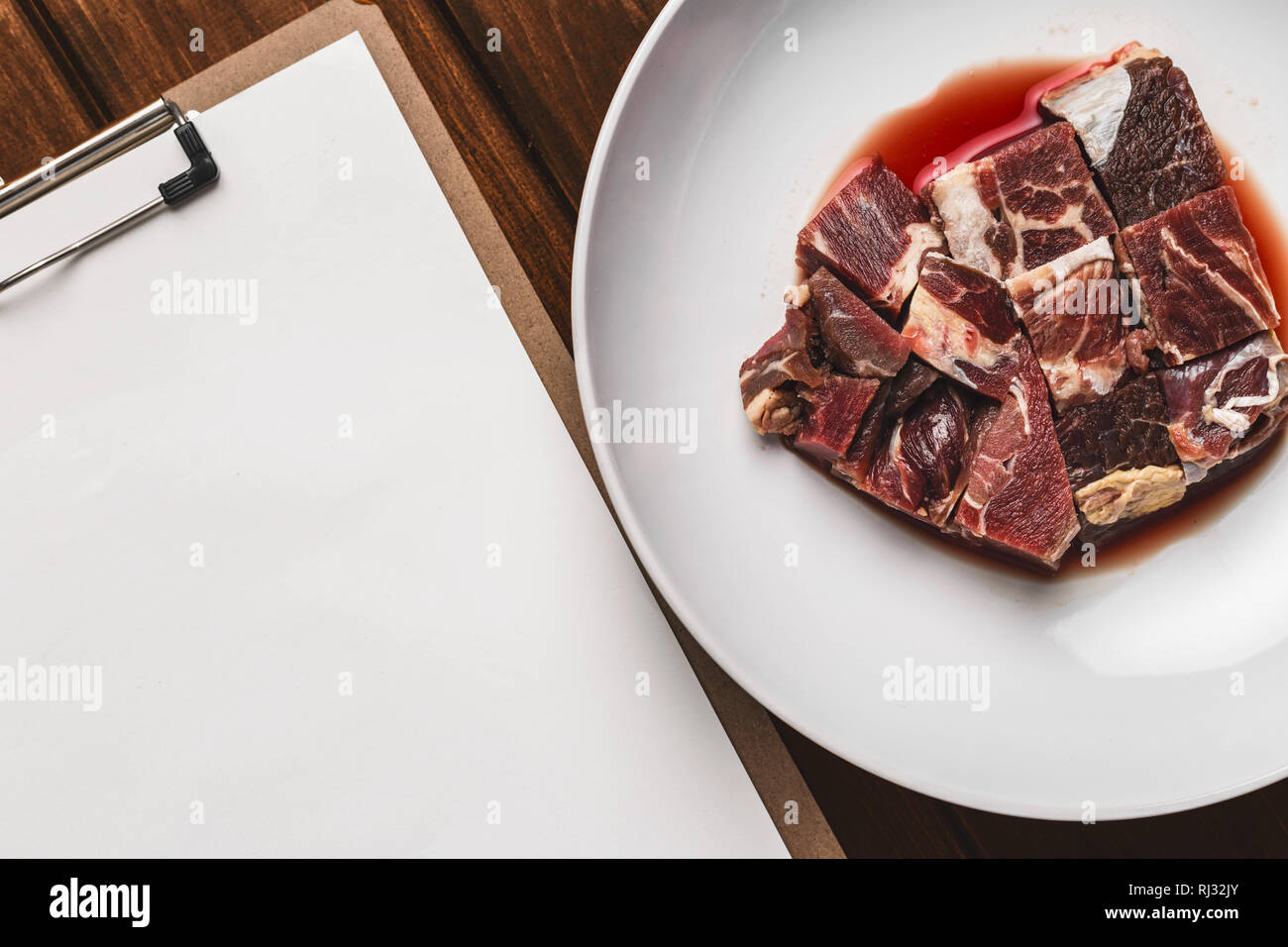 Raw beef and Clipboard nice photo Stock Photo - Alamy