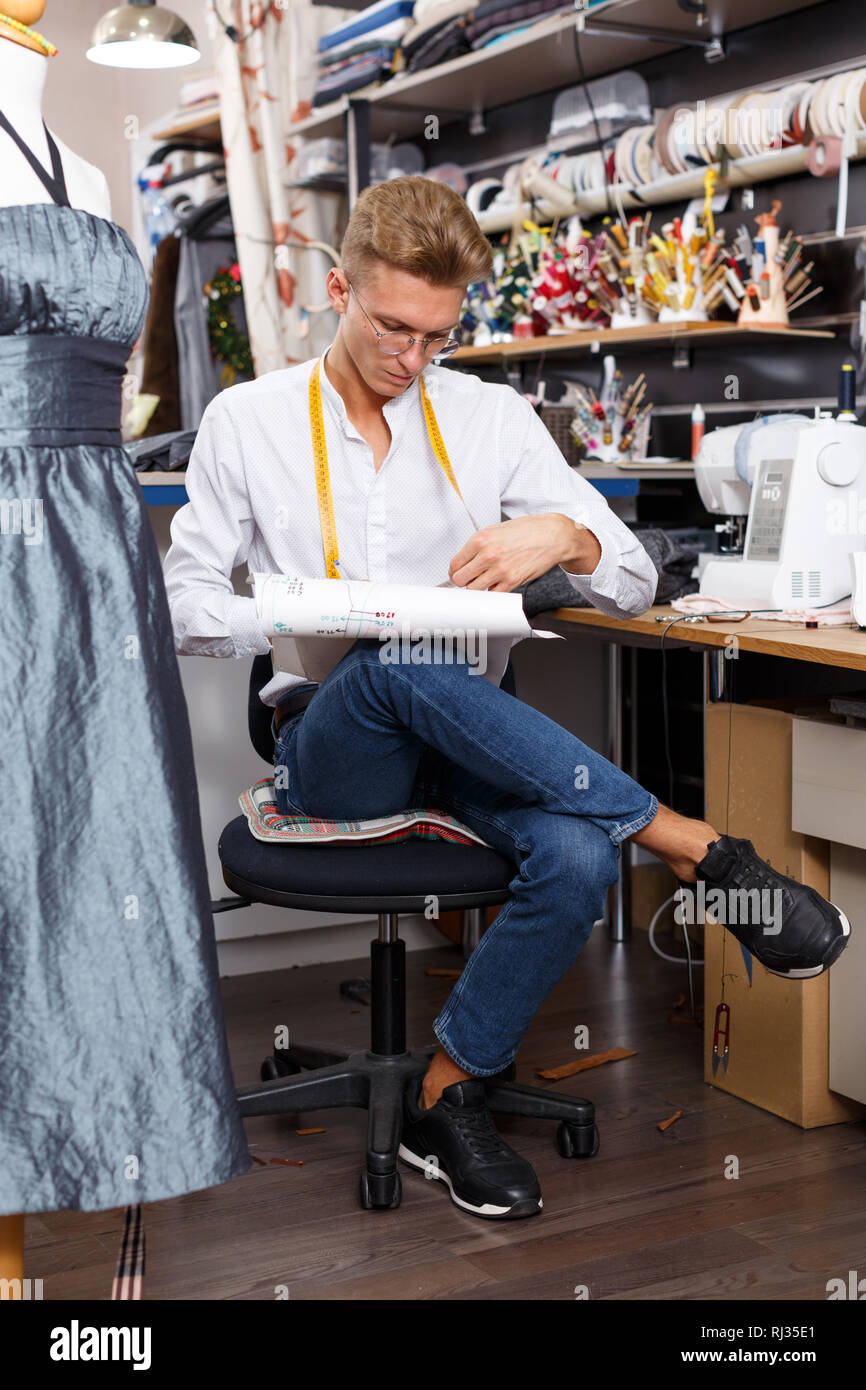 Professional male tailor designing dress style at sewing atelier Stock ...