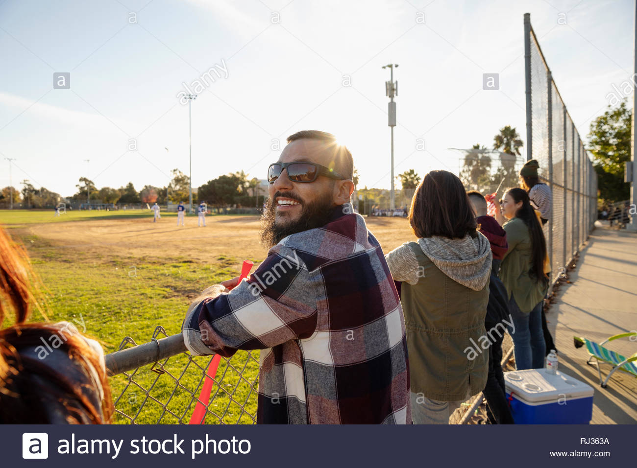 Man watching over fence hi-res stock photography and images - Alamy