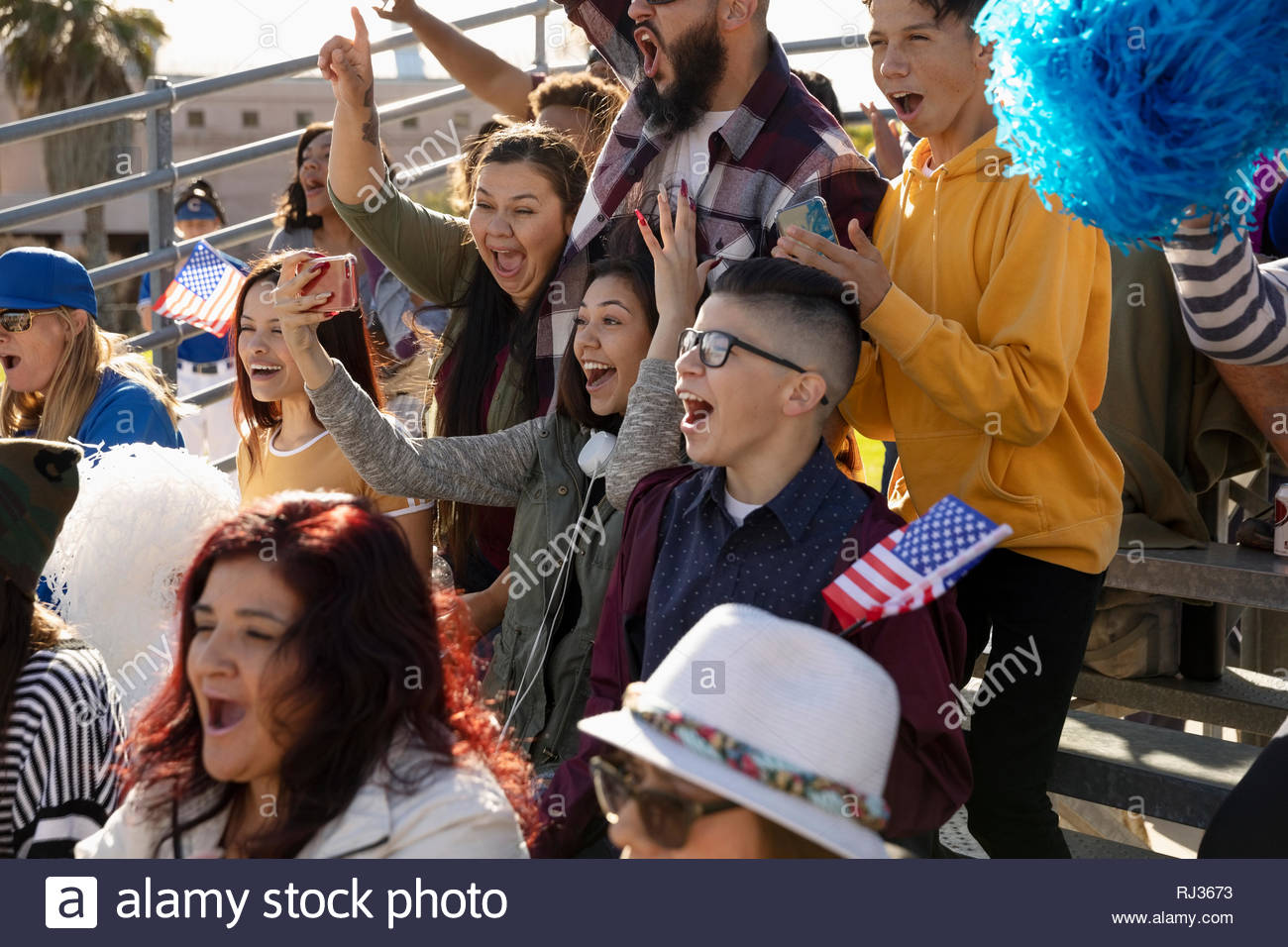 Enthusiastic Latinx baseball fans cheering in bleachers Stock Photo - Alamy