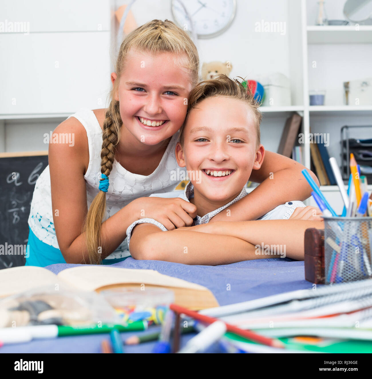 Portrait of friendly brother and sister at home Stock Photo - Alamy