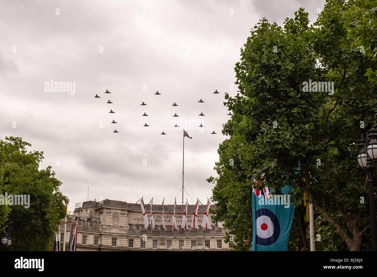 Historic Royal Air Force aircraft fly above The Mall towards Buckingham ...