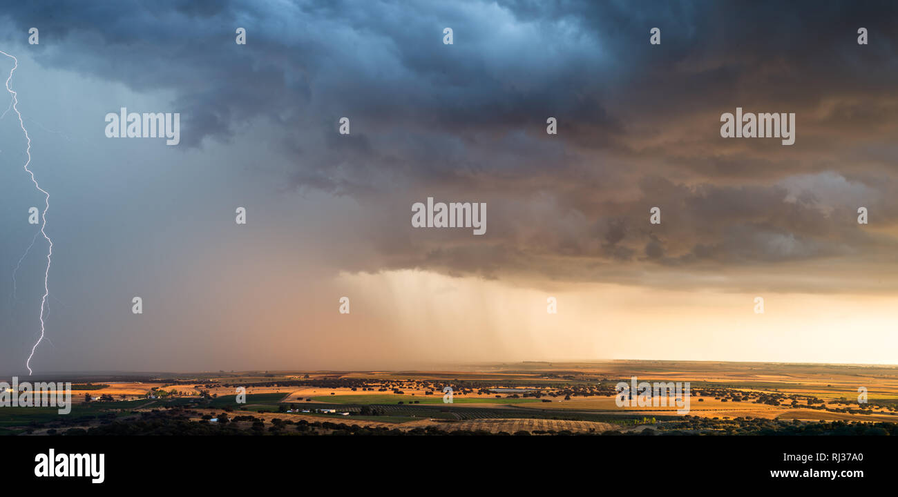 Raining storm clouds on landscape Stock Photo - Alamy