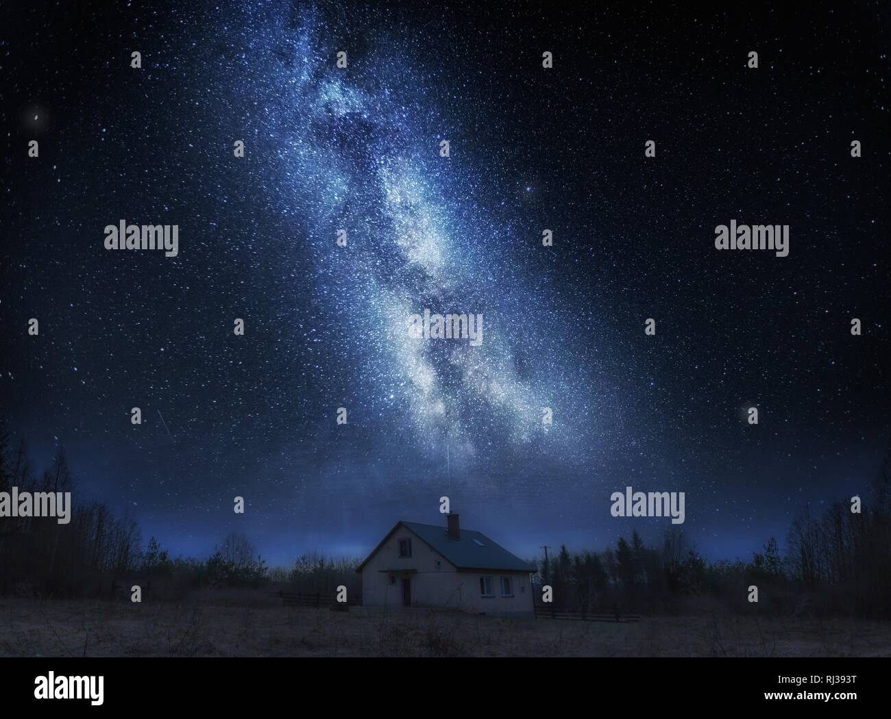 House under night sky with stars. Dreamy surreal landscape Stock Photo ...